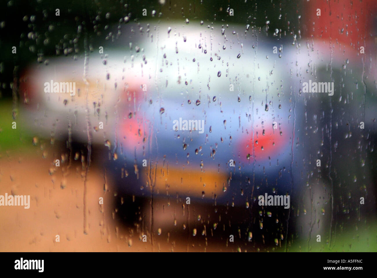car through rainy window Stock Photo - Alamy