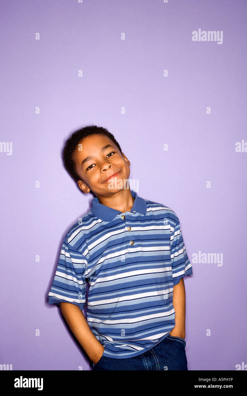 Portrait of young boy with hands in pockets Stock Photo - Alamy