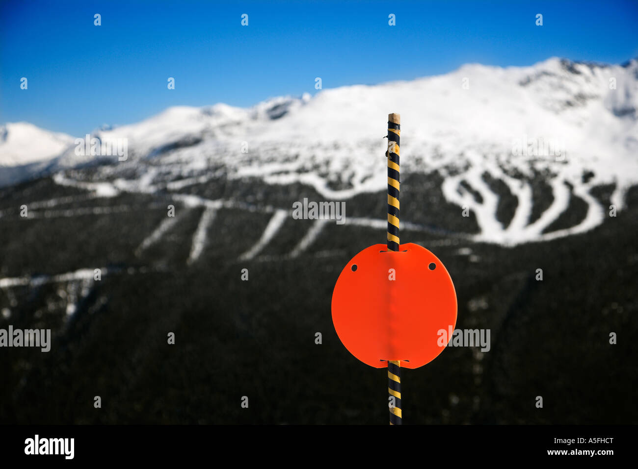 Red sign with ski slopes in background Stock Photo - Alamy