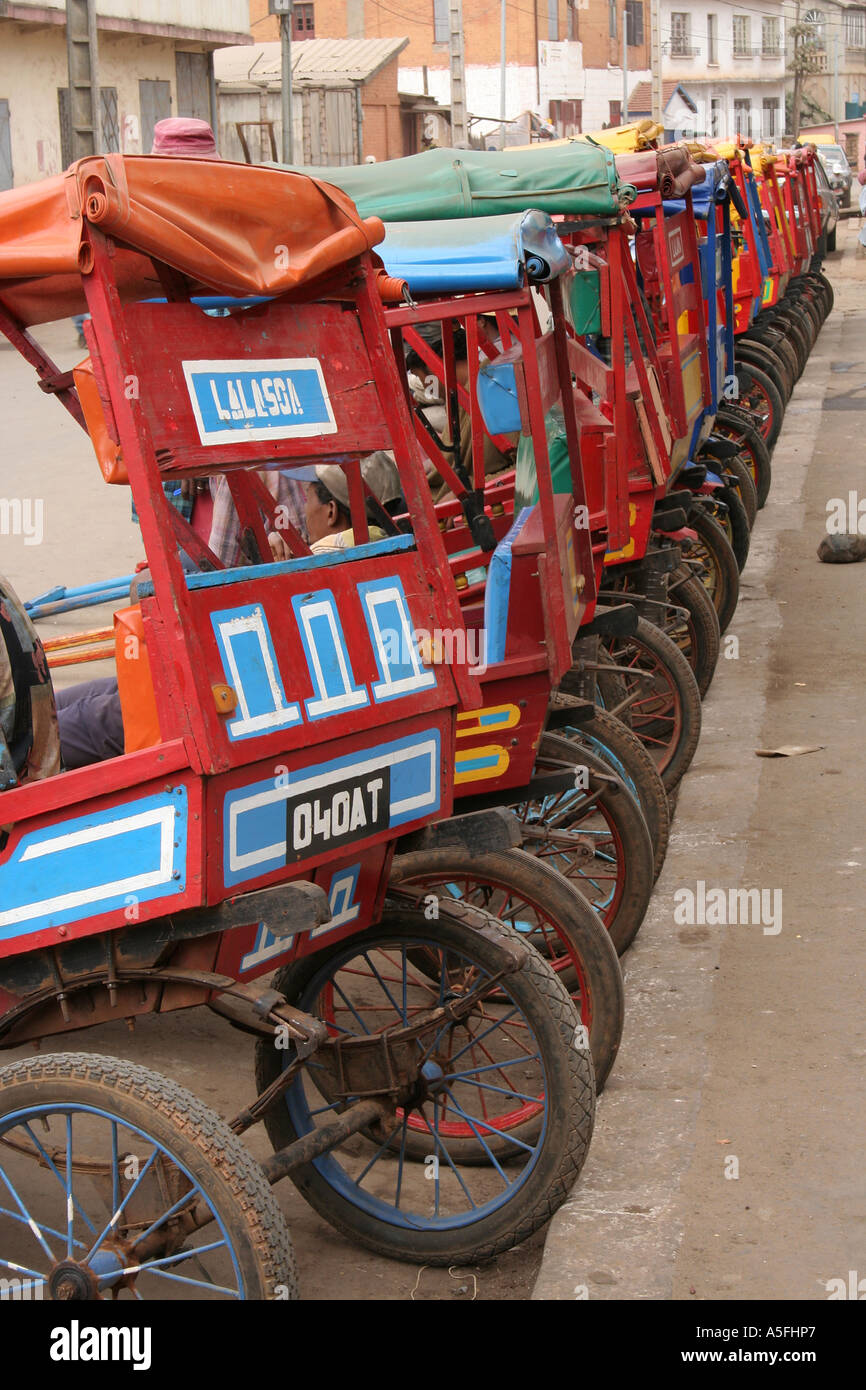 A row of pousse pousse in Ambalavao, Madagascar Stock Photo - Alamy
