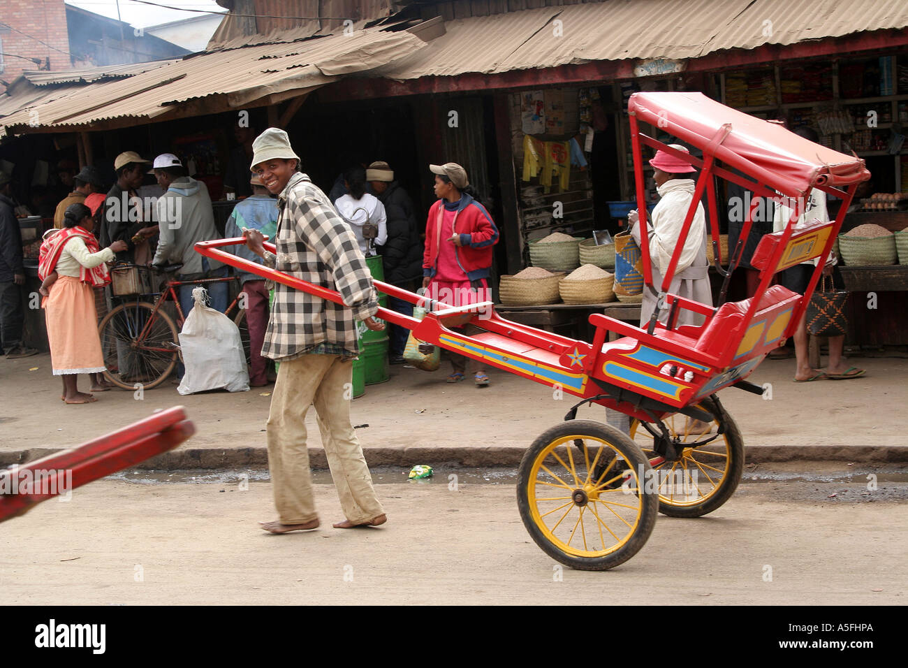 Pousse pousse driver in Ambalavao, Madagascar Stock Photo - Alamy