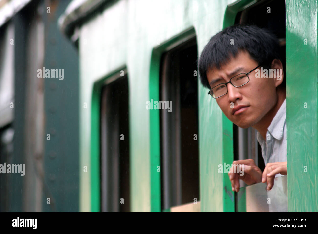 Foreigner leans out a window of the famous FCE railroad train in ...