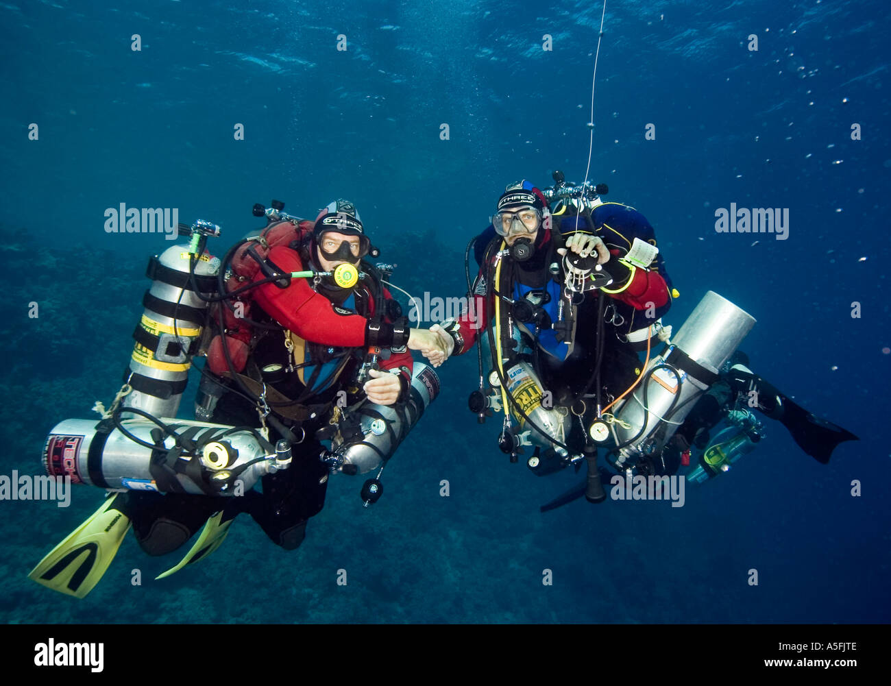 Leigh Cunningham L Mark Andrews shake after getting the world record for the deepest Wreck dive ...