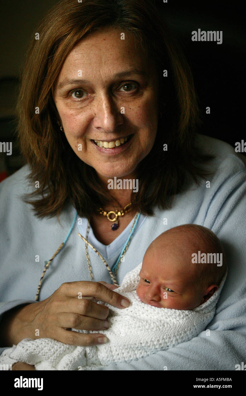 a happy grandmother holding her newly born grandchild Stock Photo - Alamy