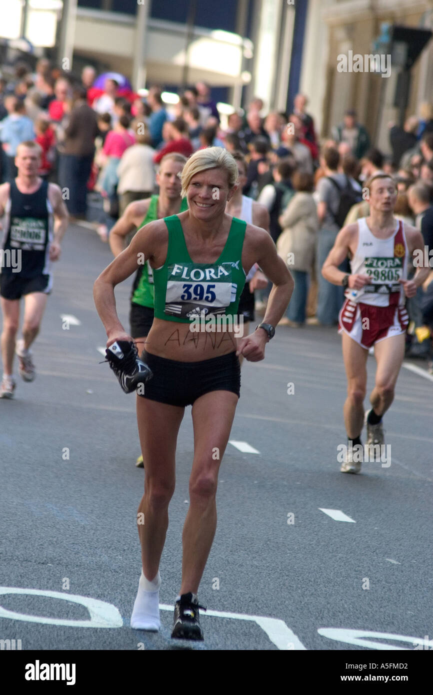 London marathon runner limping with broken shoe Stock Photo - Alamy