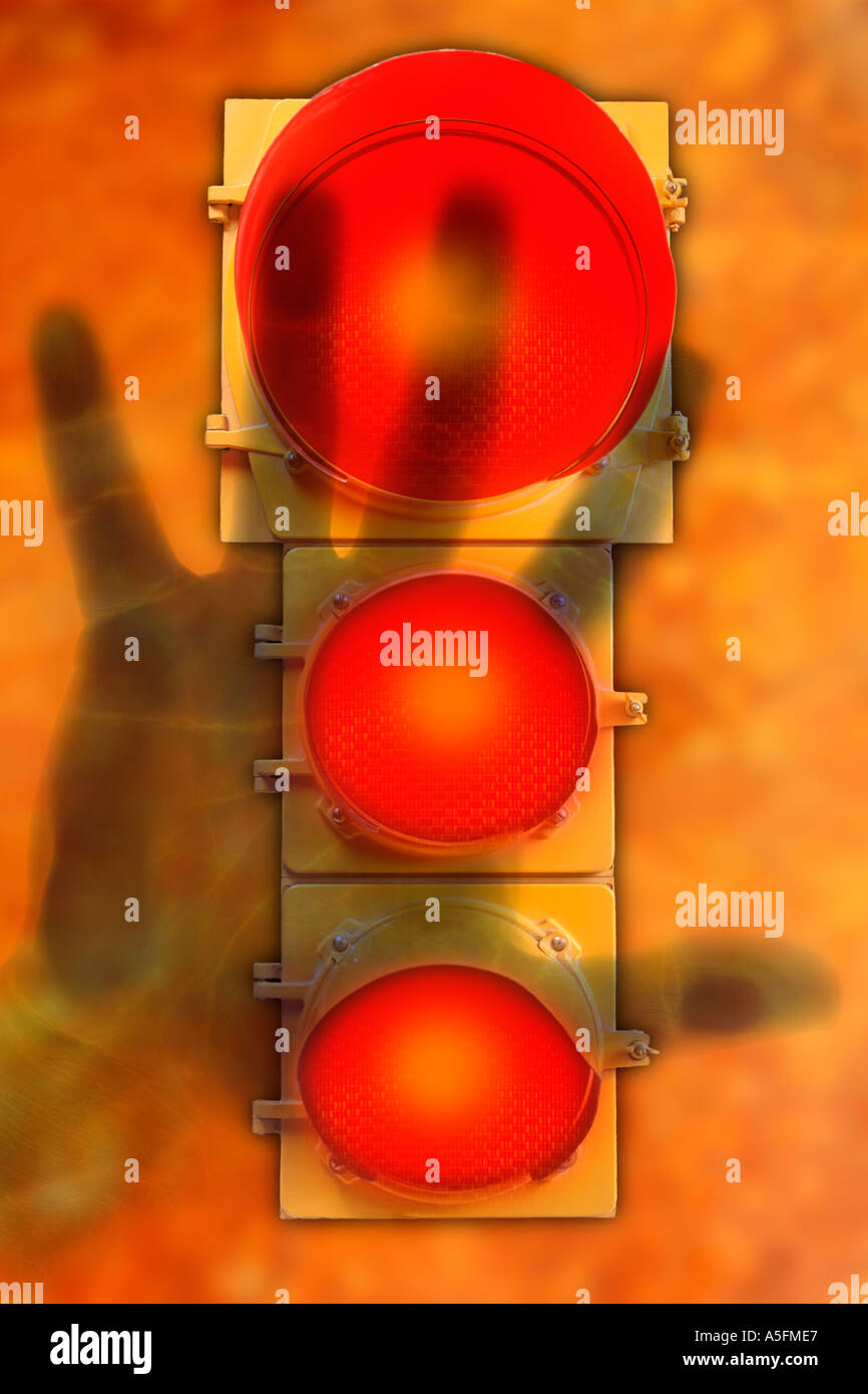 Traffic light with all three lights red Hand in stop position ...