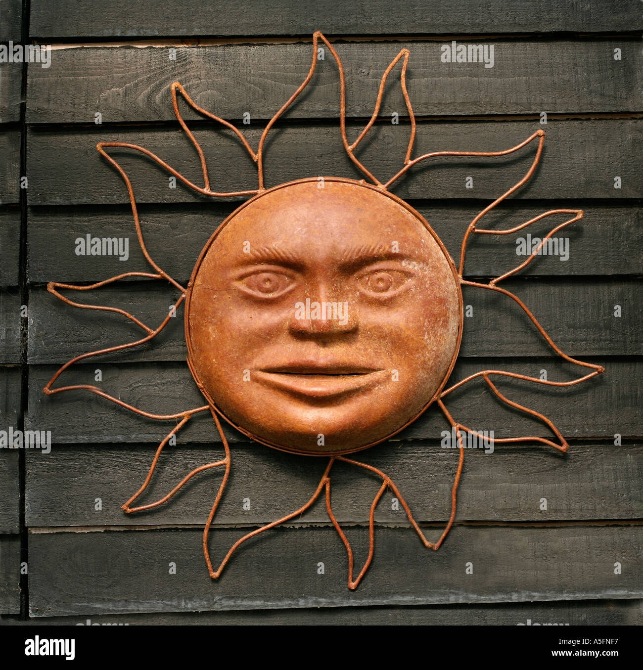 Teracotta sun face Stock Photo - Alamy
