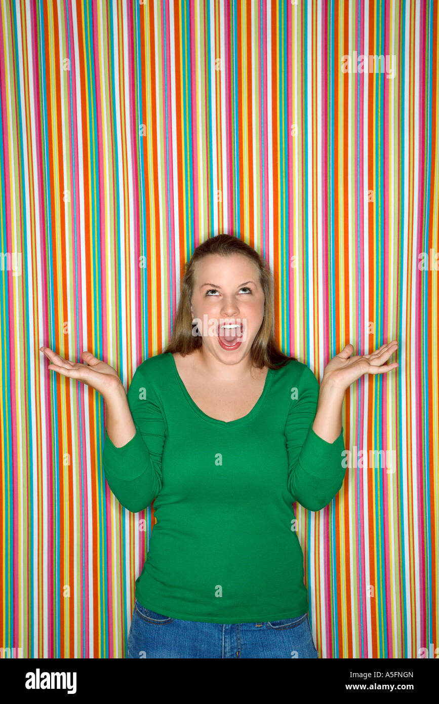 Young Caucasian female adult shrugging and making facial expression ...