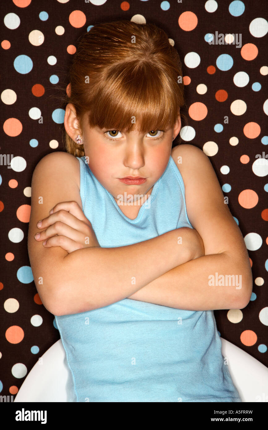 Caucasian female child pouting with arms crossed Stock Photo - Alamy