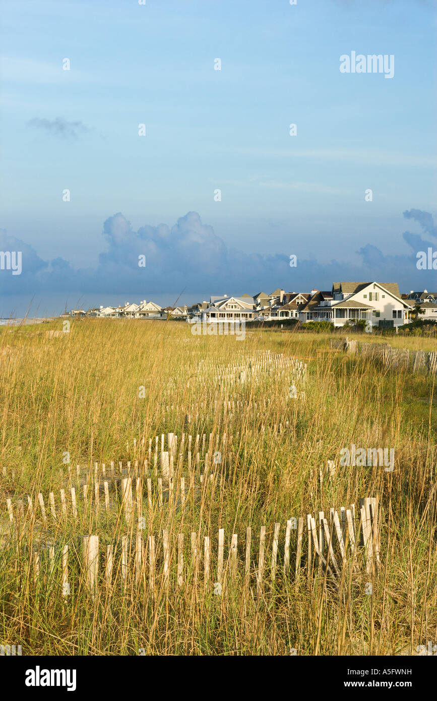 Natural beach area with houses Stock Photo - Alamy
