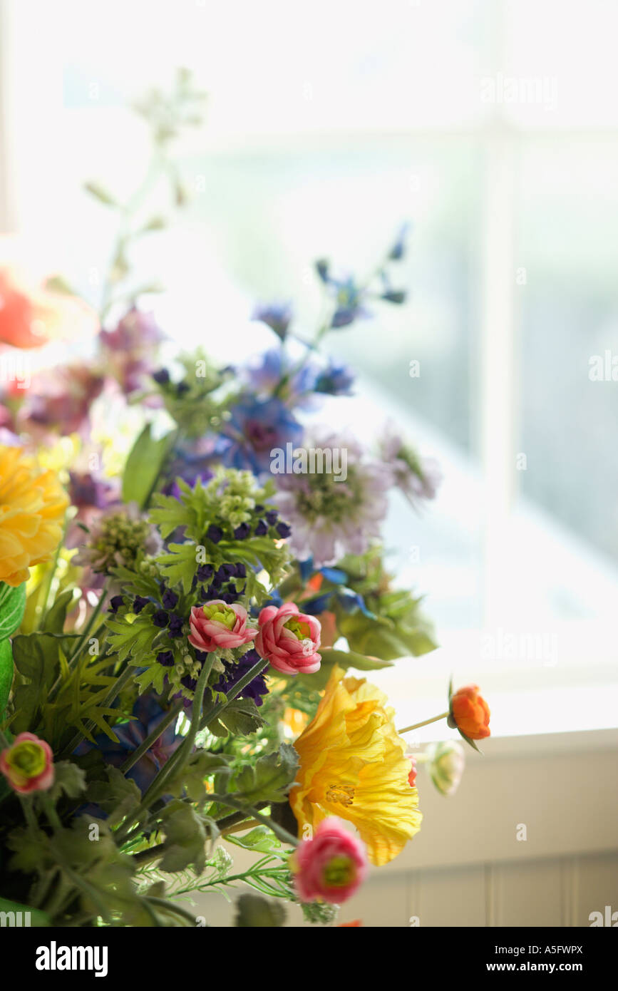 Flower arrangement in front of window Stock Photo - Alamy