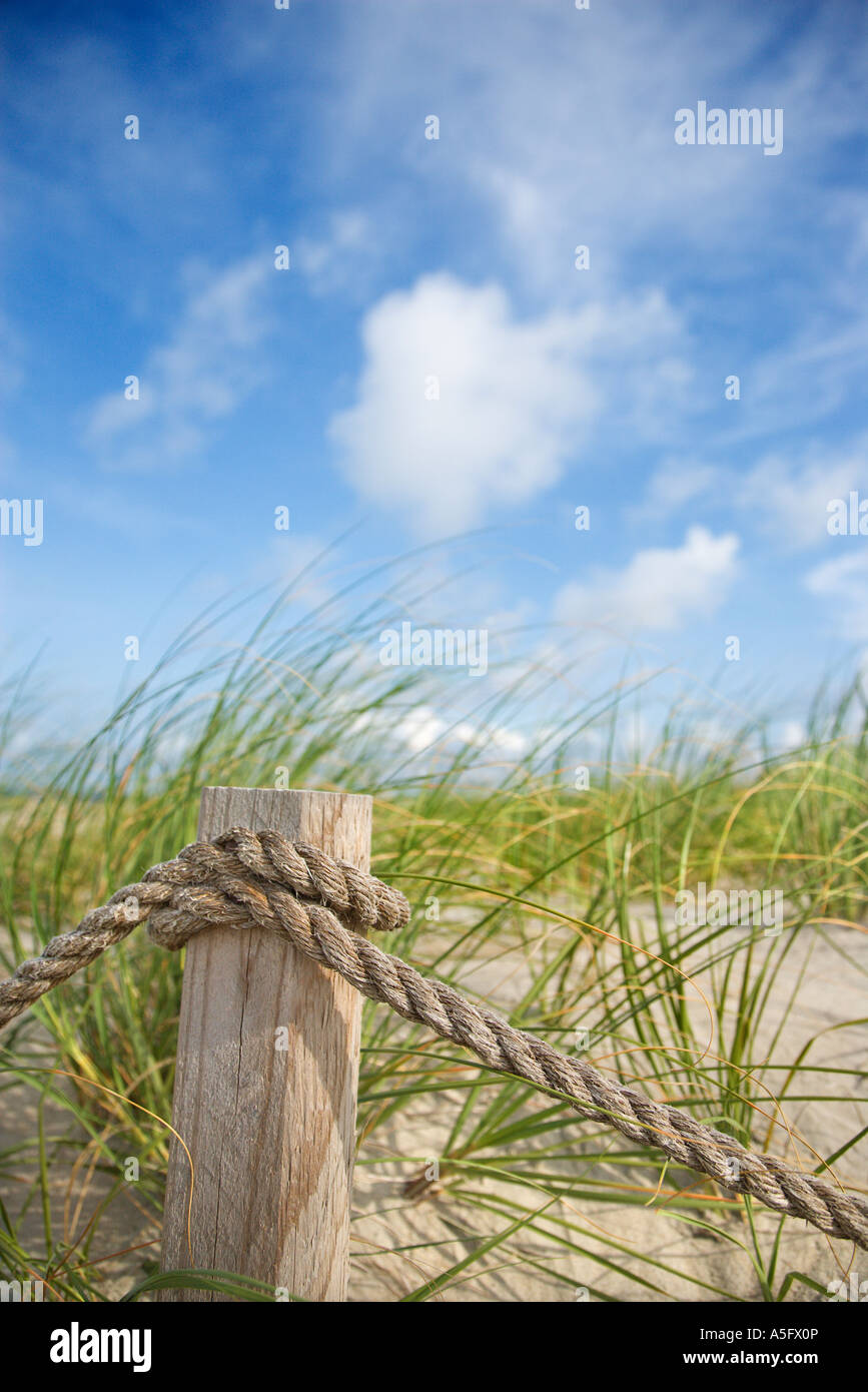 Rope fence barrier on beach Stock Photo - Alamy