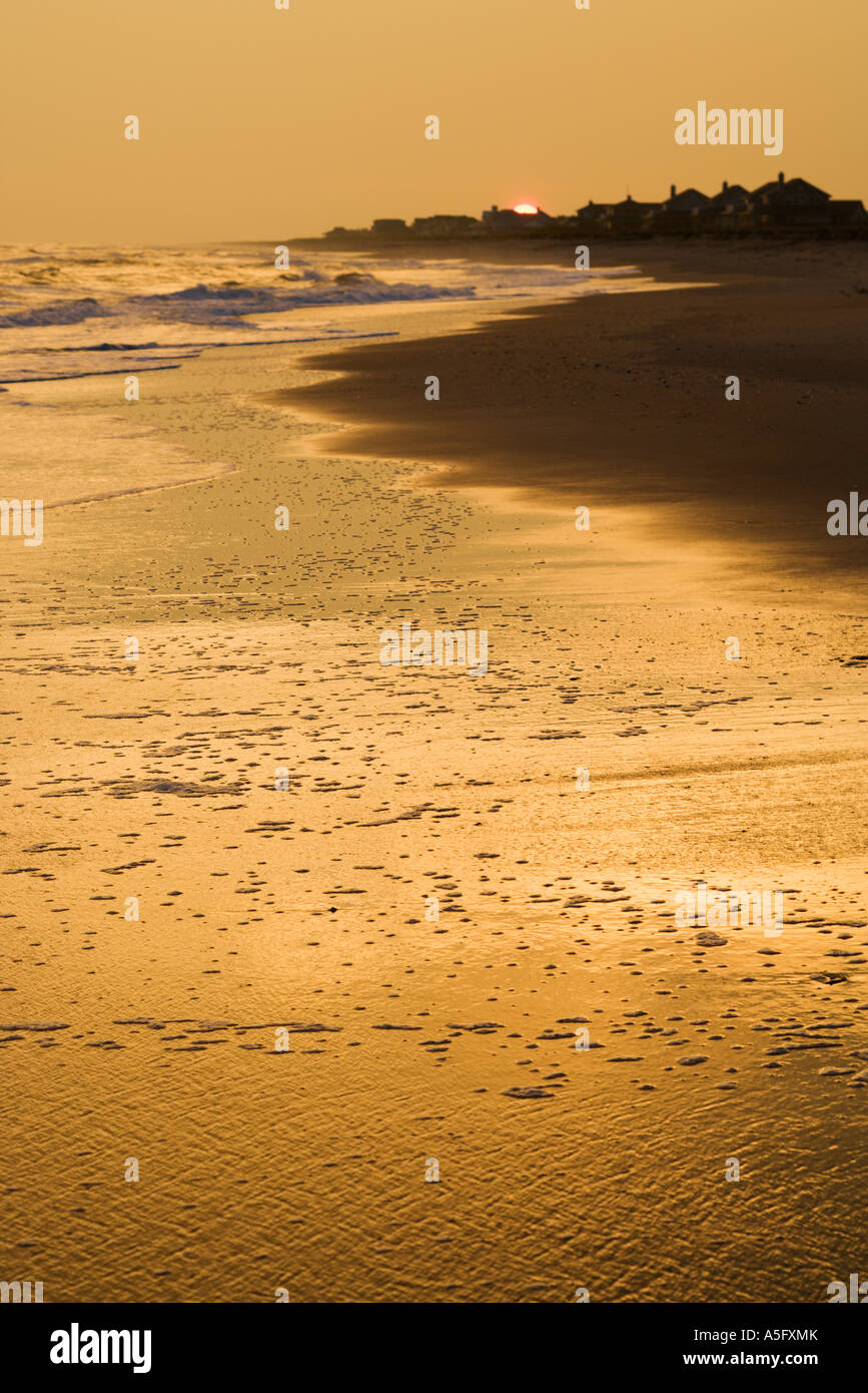 Golden beach at sunset Stock Photo - Alamy