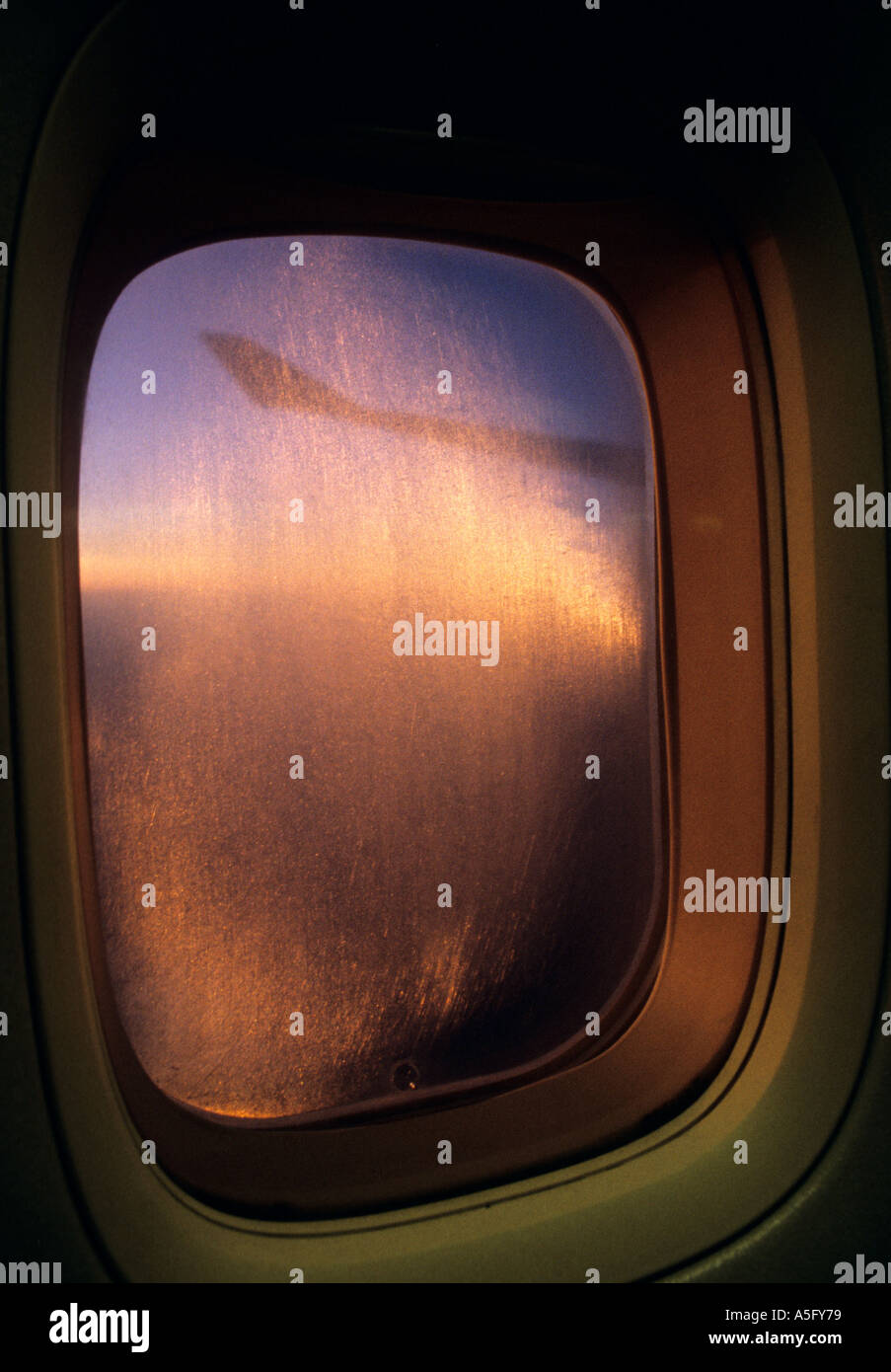 USA Airplane frozen window wing and sunset Stock Photo - Alamy