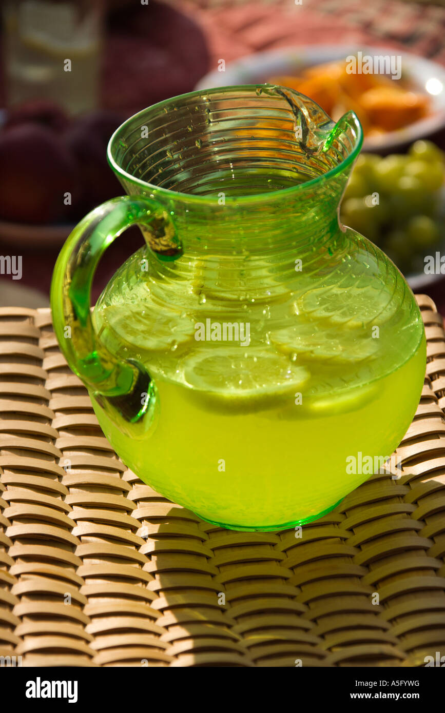 Pitcher of lemonade with sliced lemons Stock Photo - Alamy