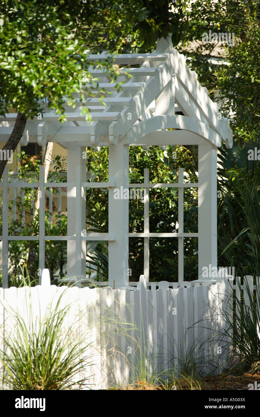 Garden arbor with white picket fence Stock Photo - Alamy
