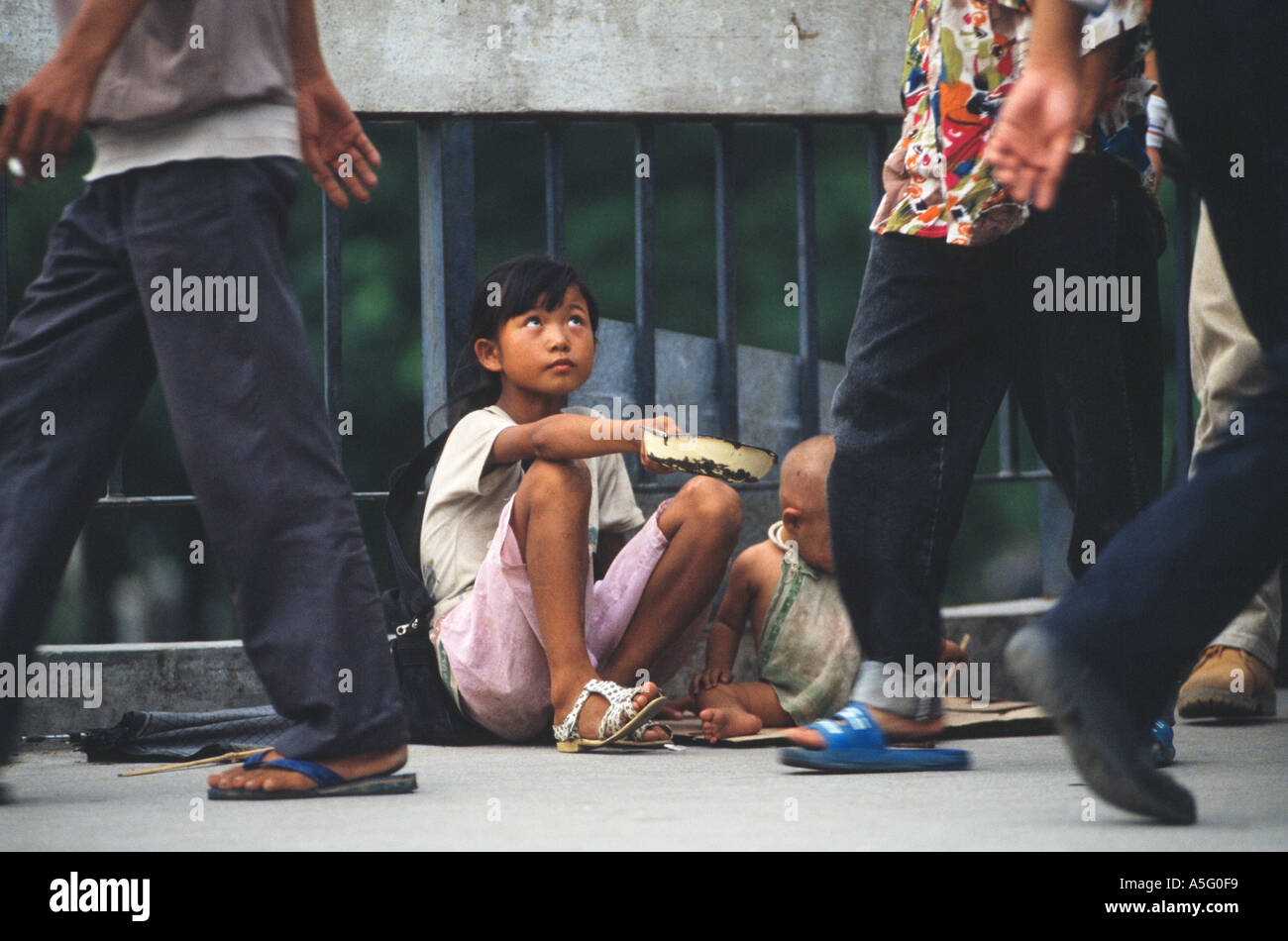 Children begging in streets of Shenzhen Images of economic change in ...