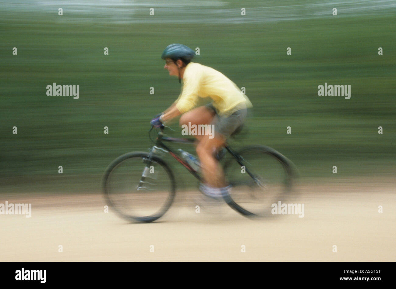 Mountain biker motion blur Stock Photo - Alamy