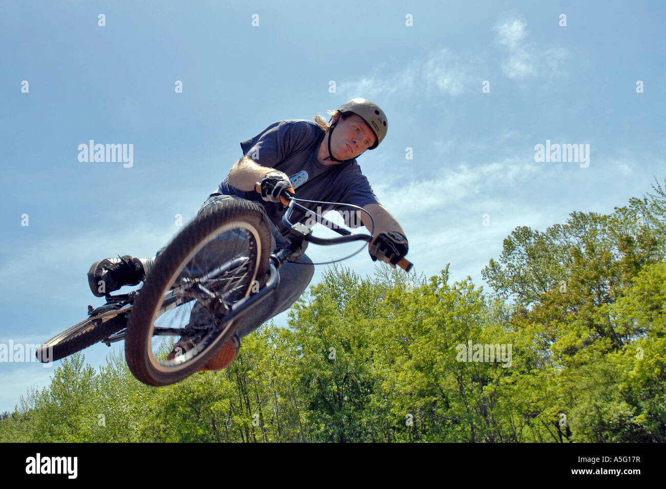Biker performing stunt at a competition Stock Photo - Alamy