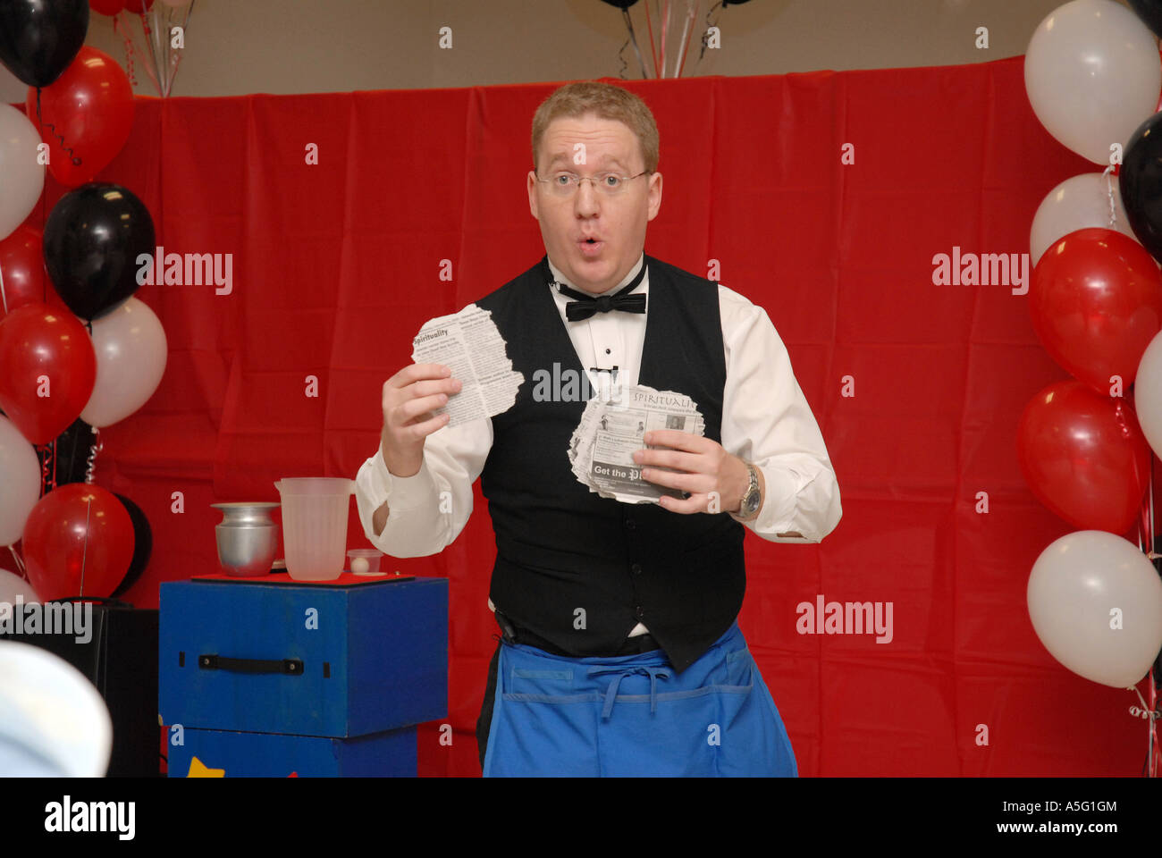Magician performing trick Stock Photo - Alamy
