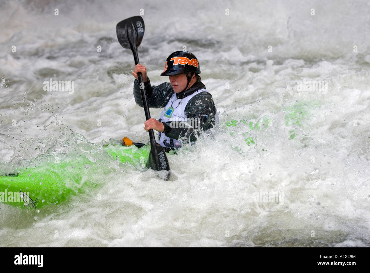 Kayaker paddles through class five rapid at a whitewater race Stock ...
