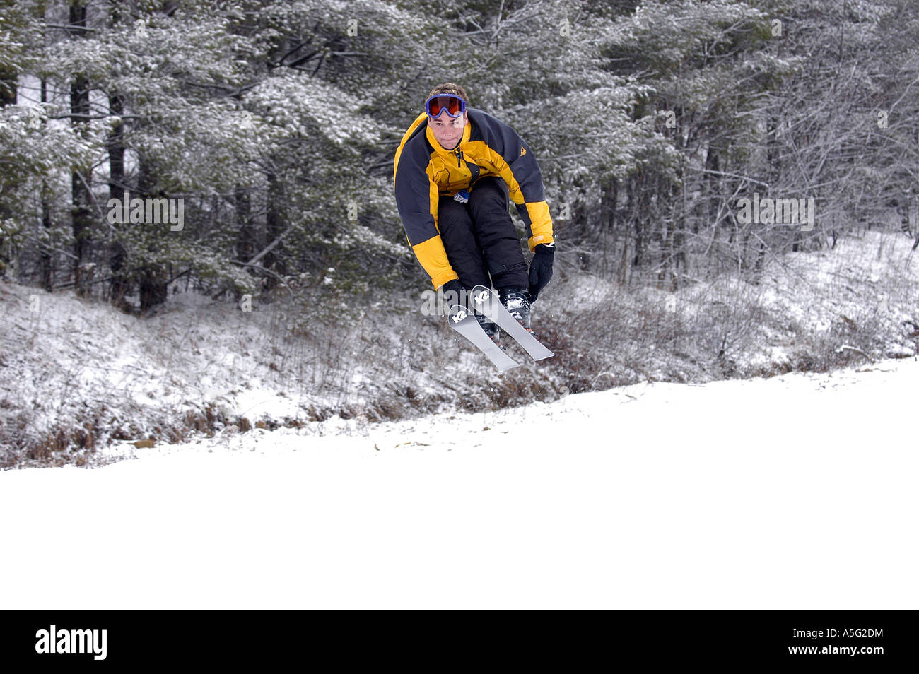 Skier showing off by getting air and speed on a downhill slope Stock ...