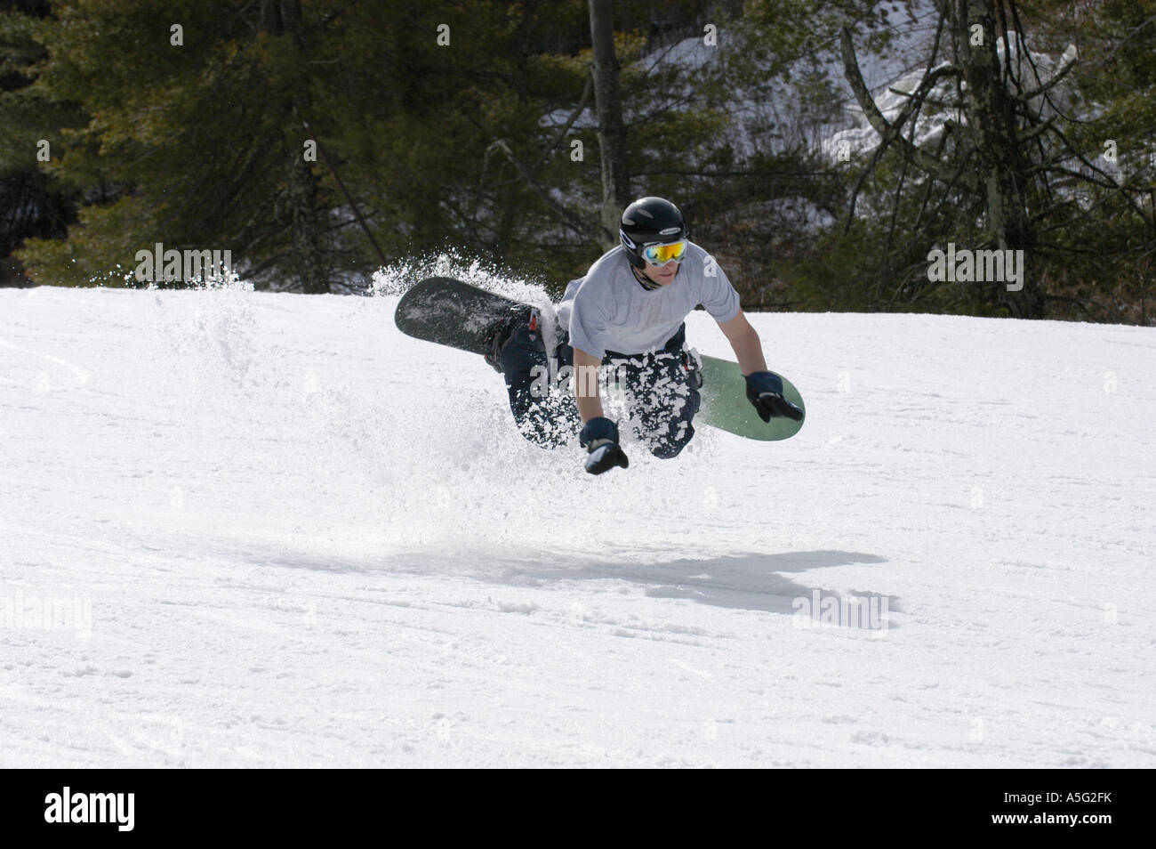 Beginner snowboarder about to crash Stock Photo - Alamy