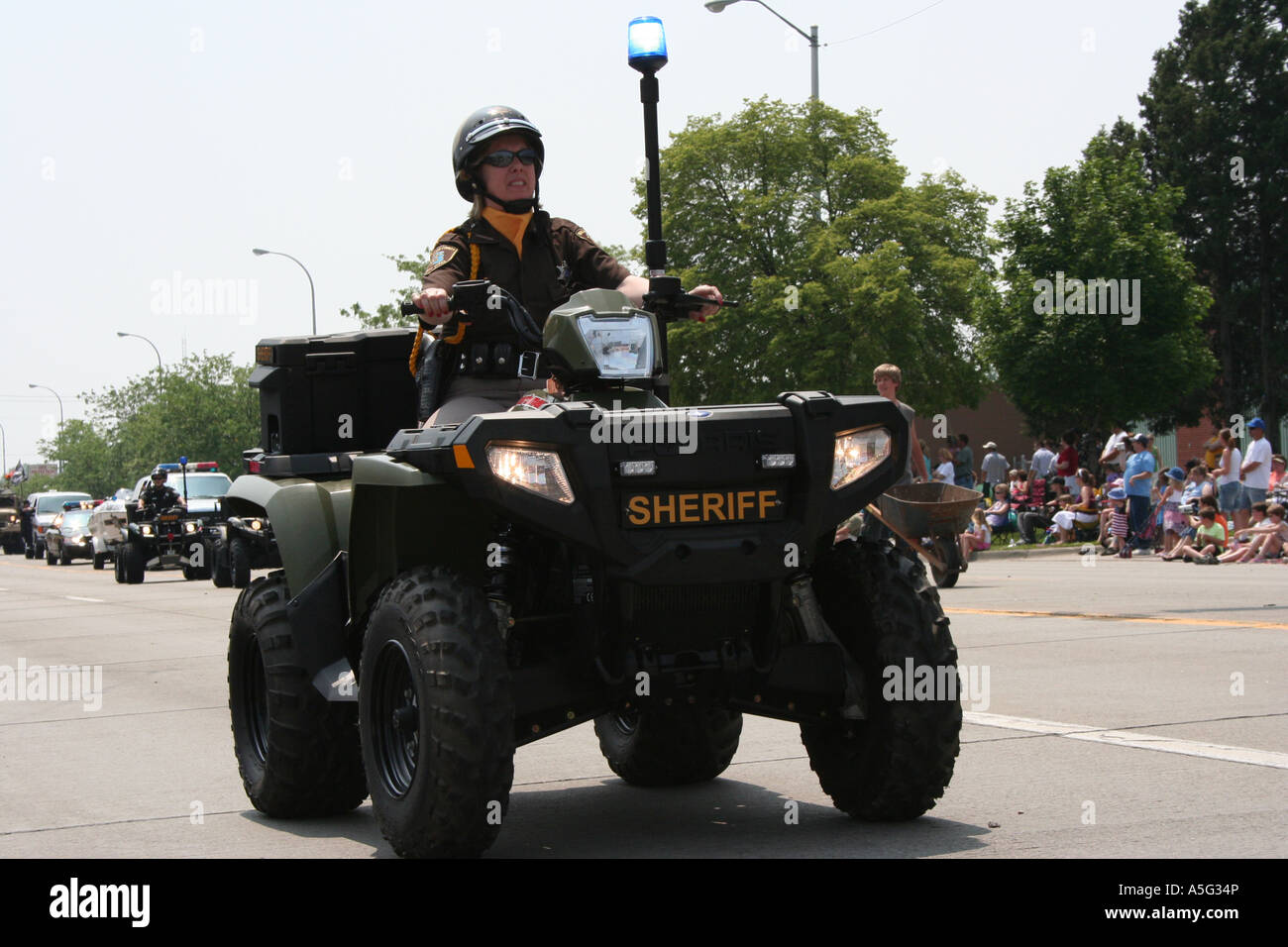 An officer from the Macomb County Sheriff's Department cruises along ...
