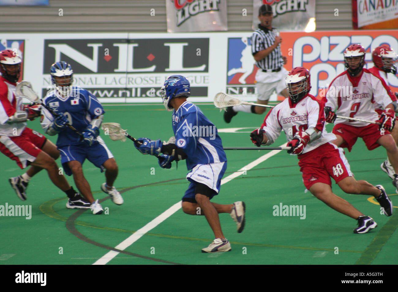 Solid defense by Team Canada forces the ball carrier on Team Japan to ...