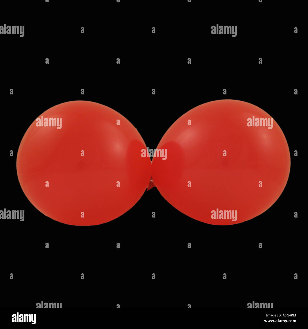 two balloons tied together representing linear shaped molecule Stock ...