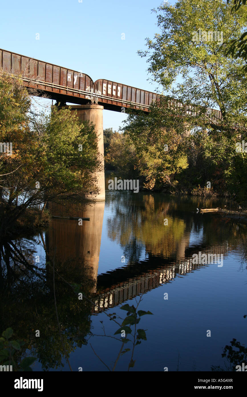 Railroad bridge over lake Stock Photo - Alamy