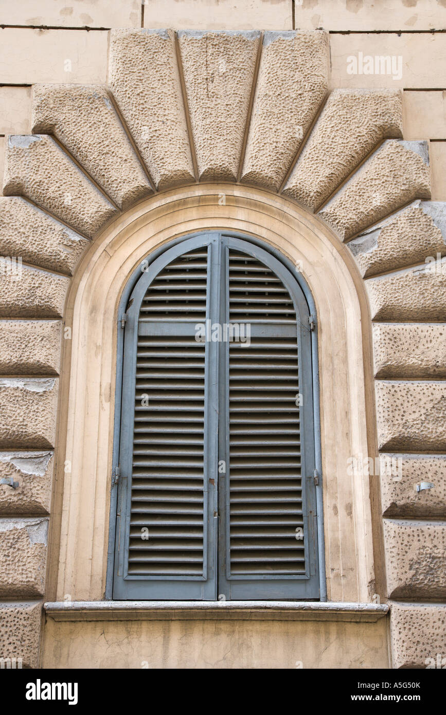Arched window with closed shutters in Rome Italy Stock Photo - Alamy