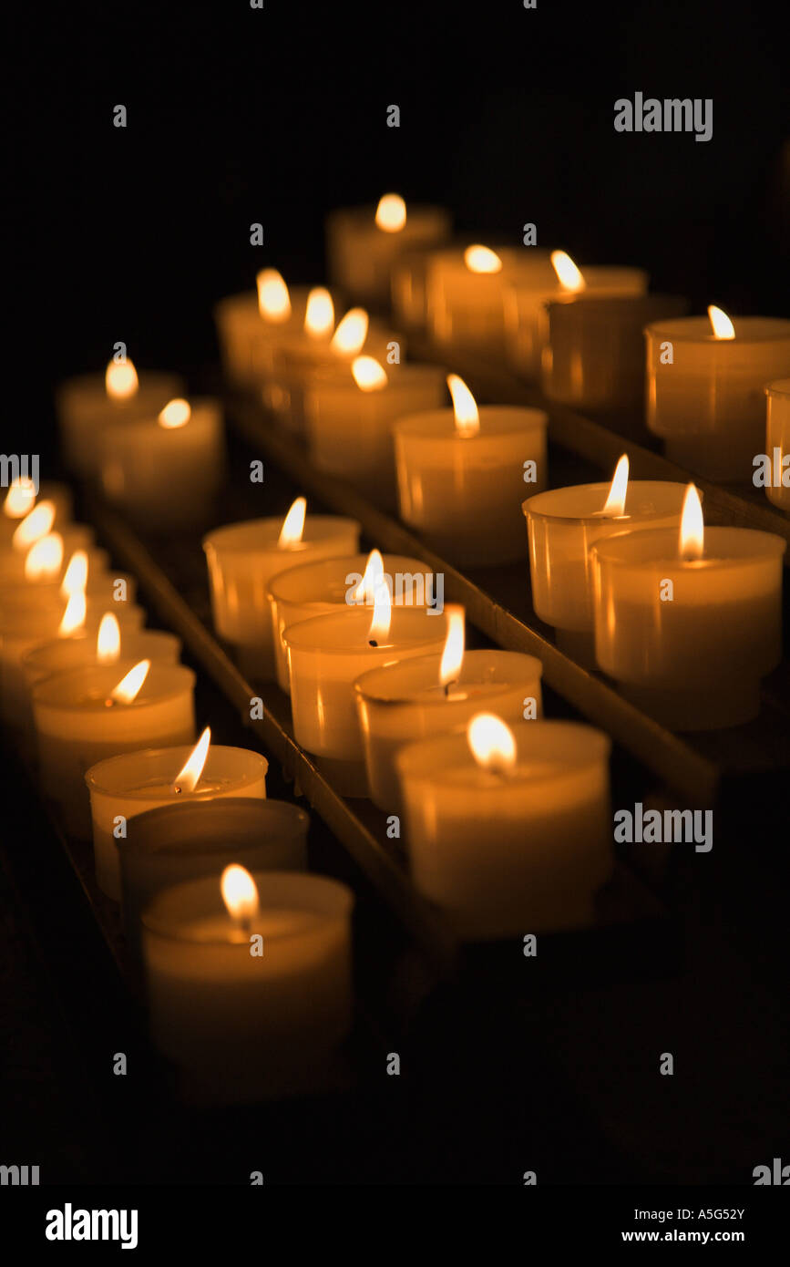 Group of lit candles in Rome Italy Stock Photo - Alamy