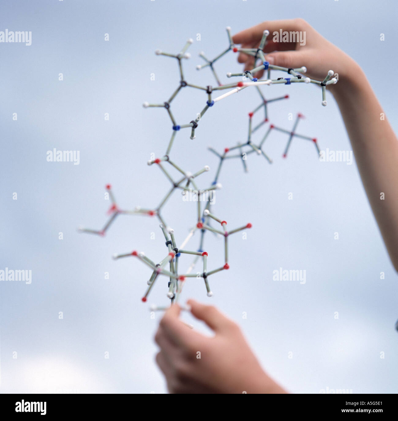 Hands and DNA Stock Photo - Alamy