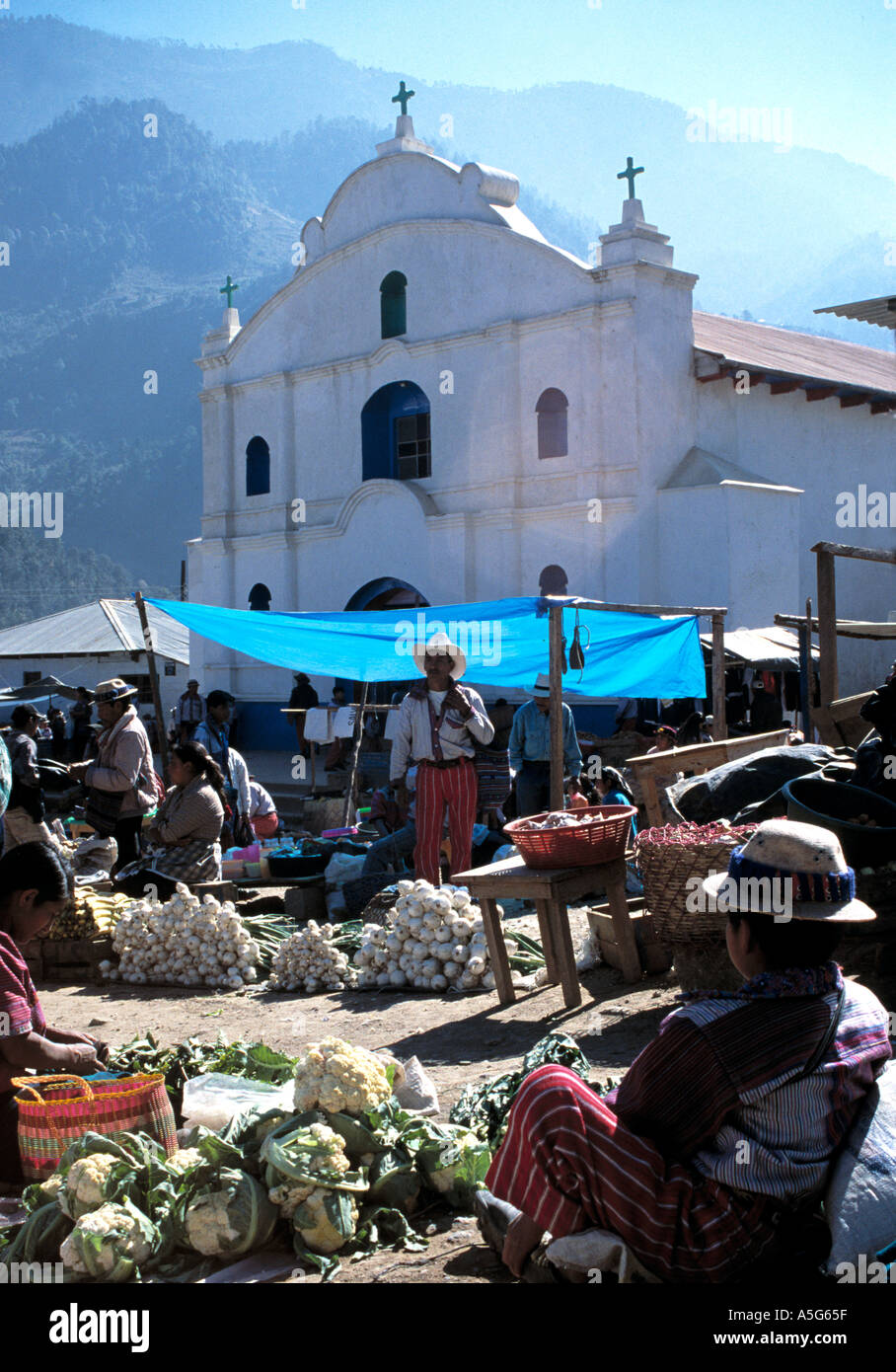 Villagers sell local produce at the central market square in the ...