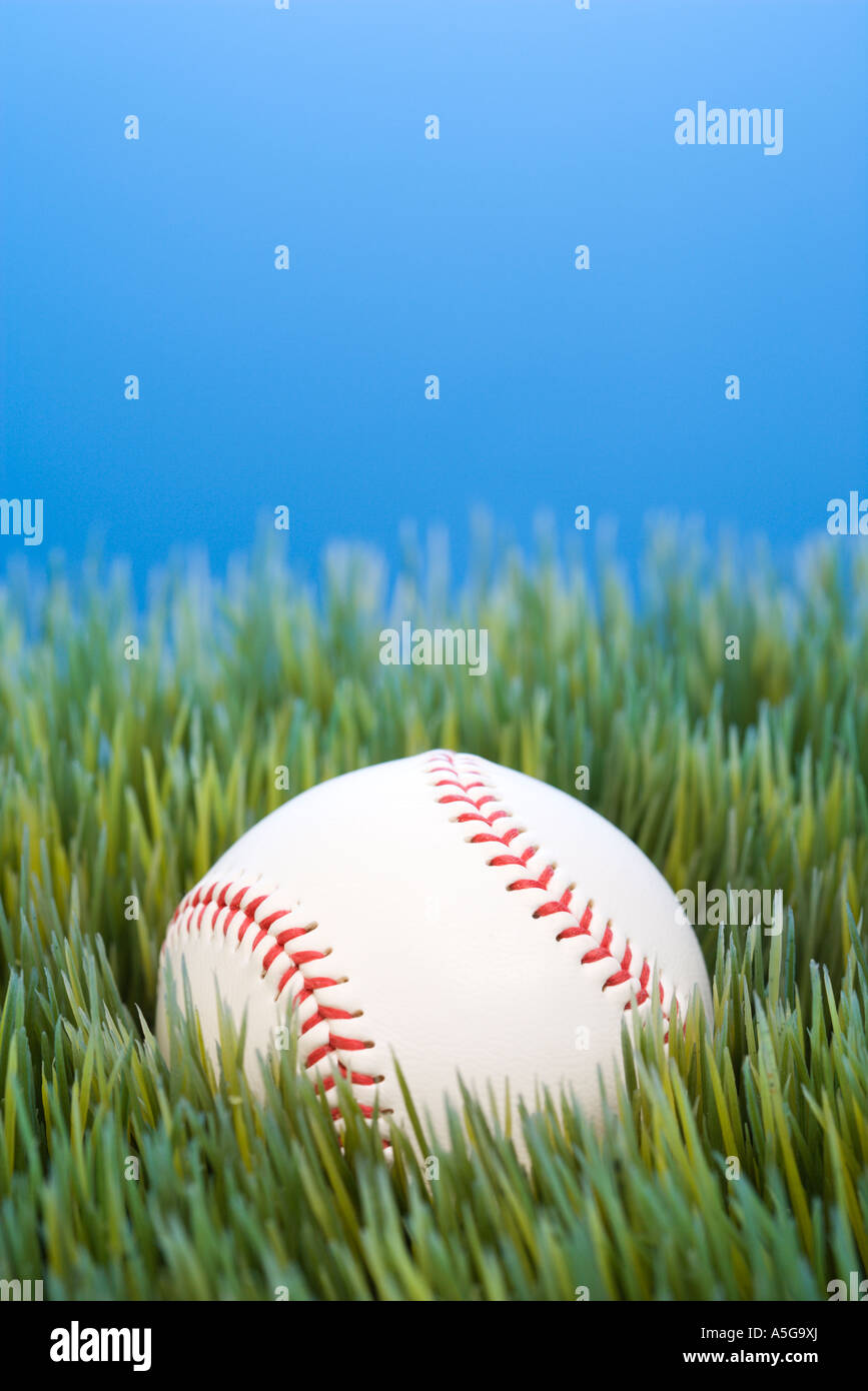 Baseball in grass vertical hi-res stock photography and images - Alamy