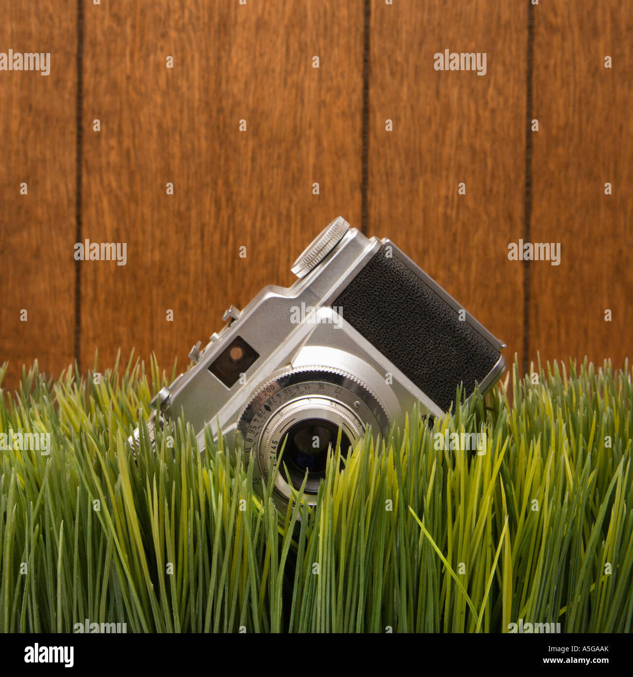 Studio shot of vintage camera with wood paneling in background Stock ...