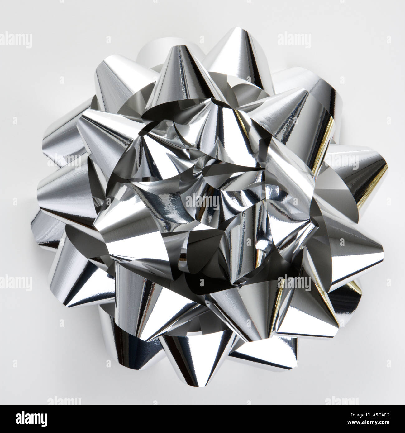 Still life of big shiny silver Christmas bow Stock Photo - Alamy