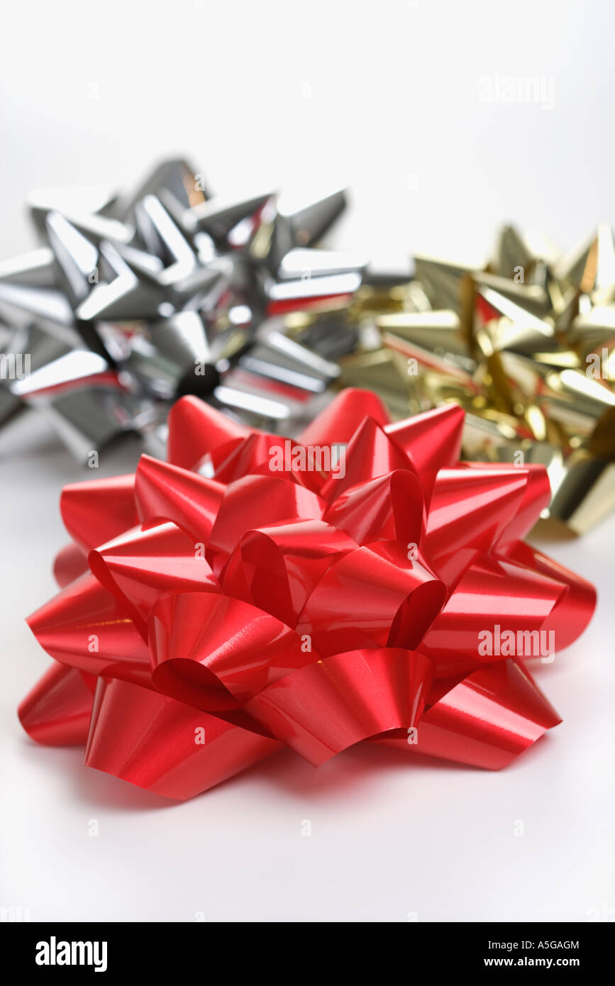 Still life of big shiny red gold and silver Christmas bows Stock Photo ...