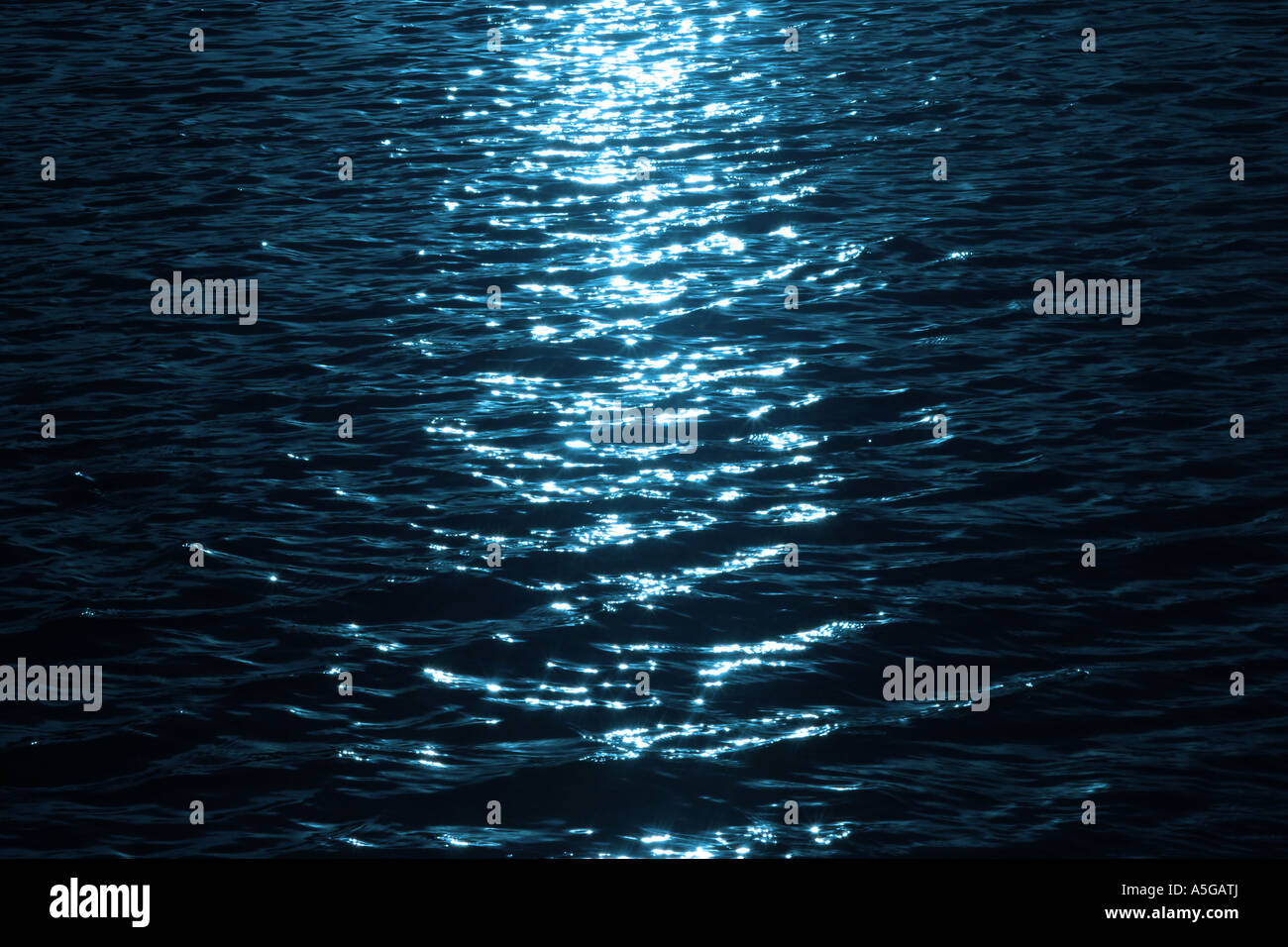 Moon reflecting in Water Surface creating a toned feeling of space ...