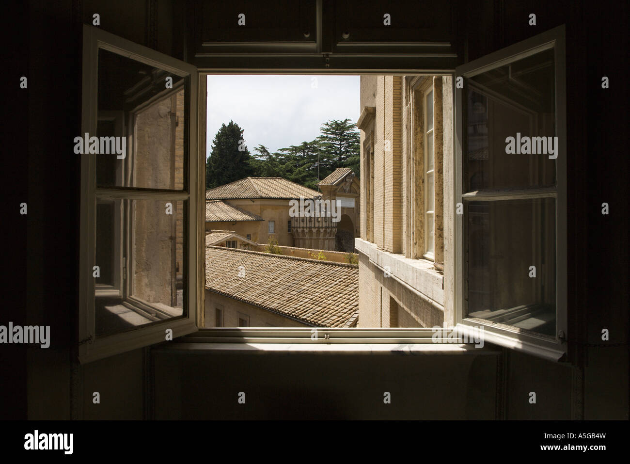 Looking out open window with view of rooftops in the Vatican Museum ...