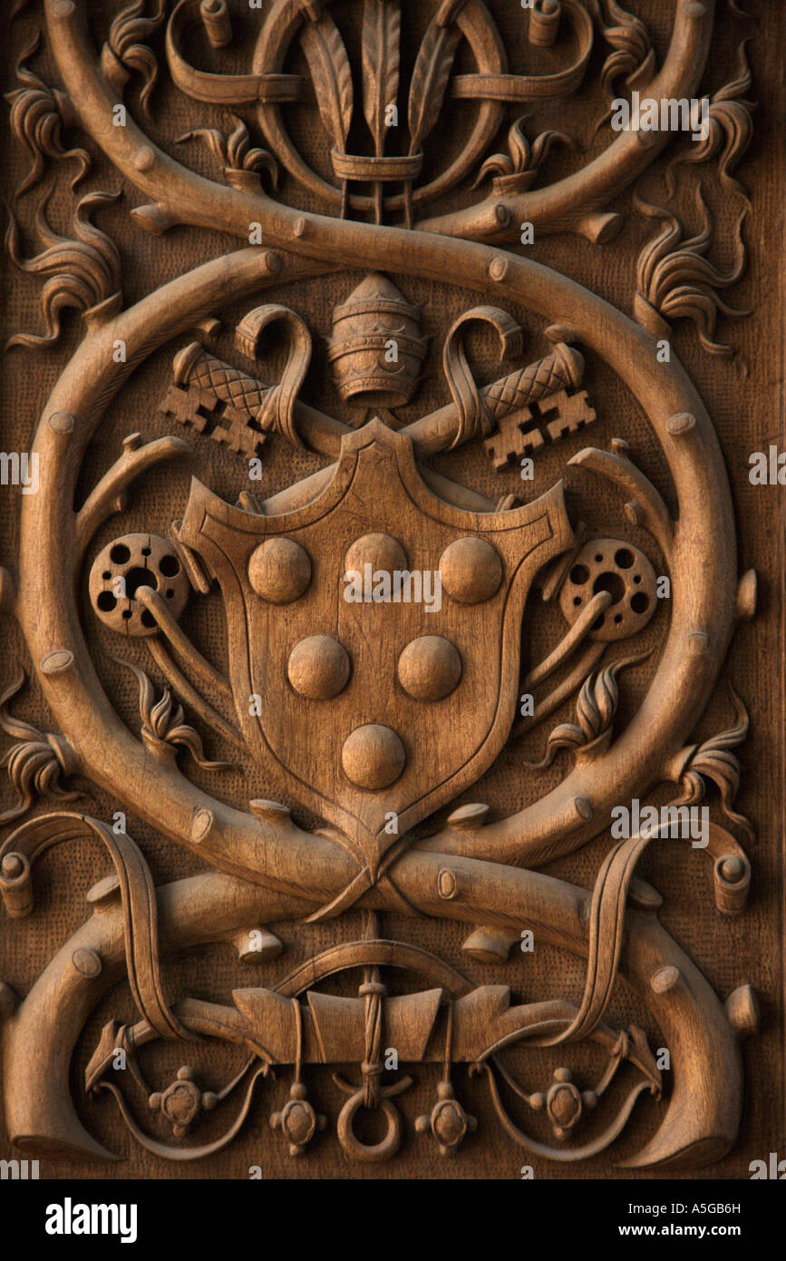 Close up wood carving of Papal coat of arms in the Vatican Museum Rome ...