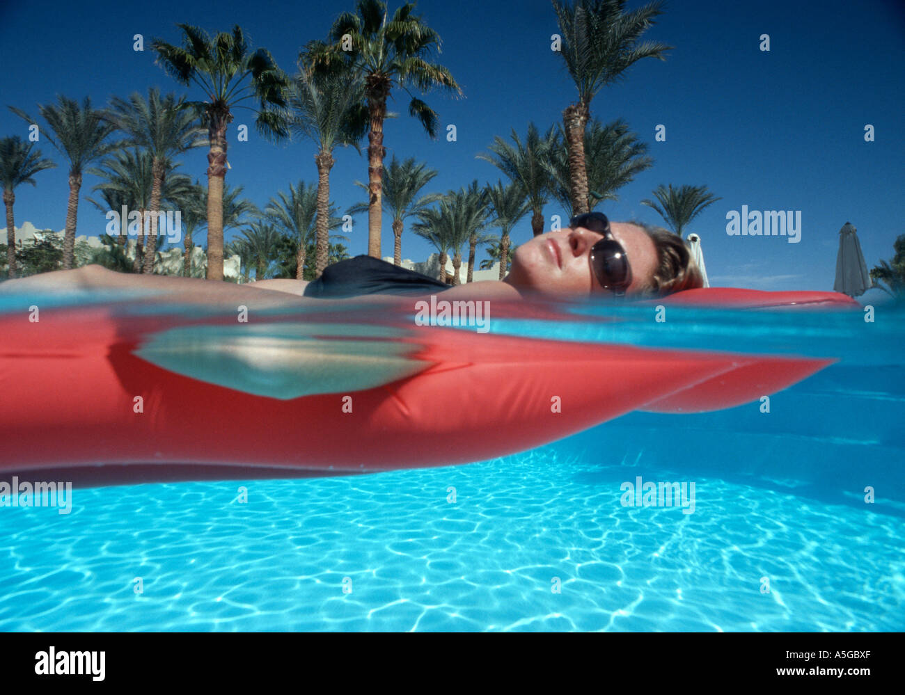 Girl floating on lilo swimming pool hotel Sharm el Sheikh Sinai Red Sea ...
