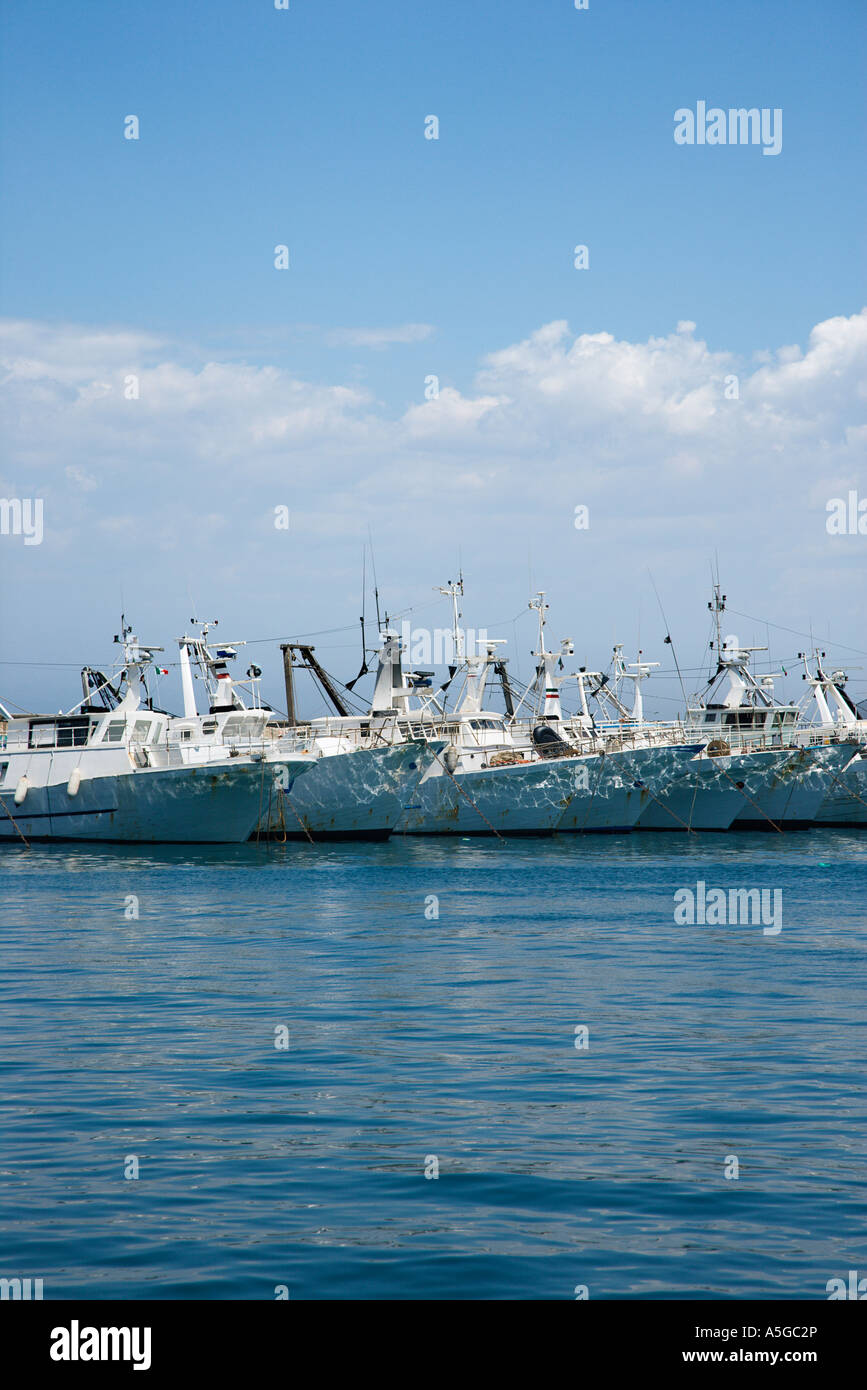Fleet of boats moored together Stock Photo - Alamy