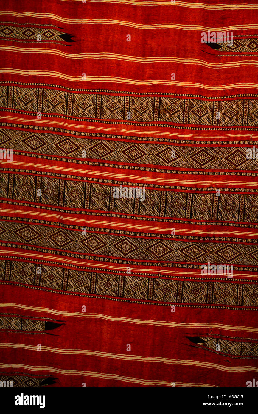 Vertical close up image of ancient berber textile exhibit in Guellala ...