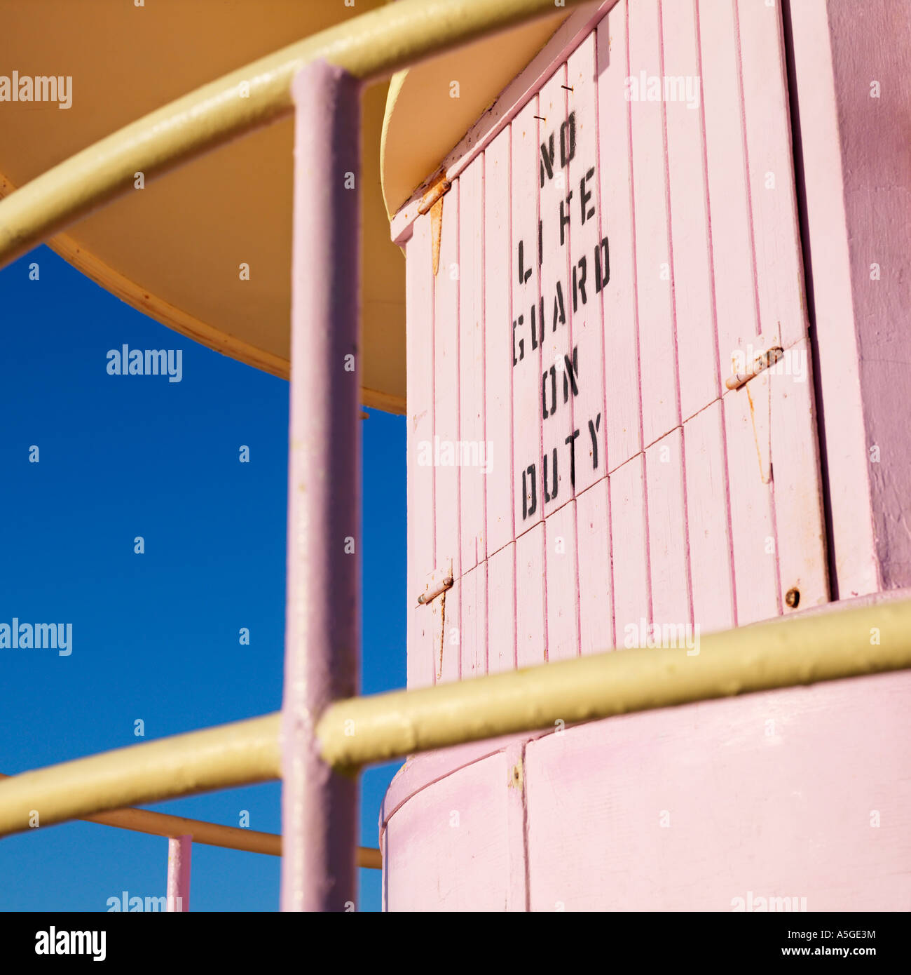 Close up of pink art deco lifeguard tower with no lifeguard on duty ...