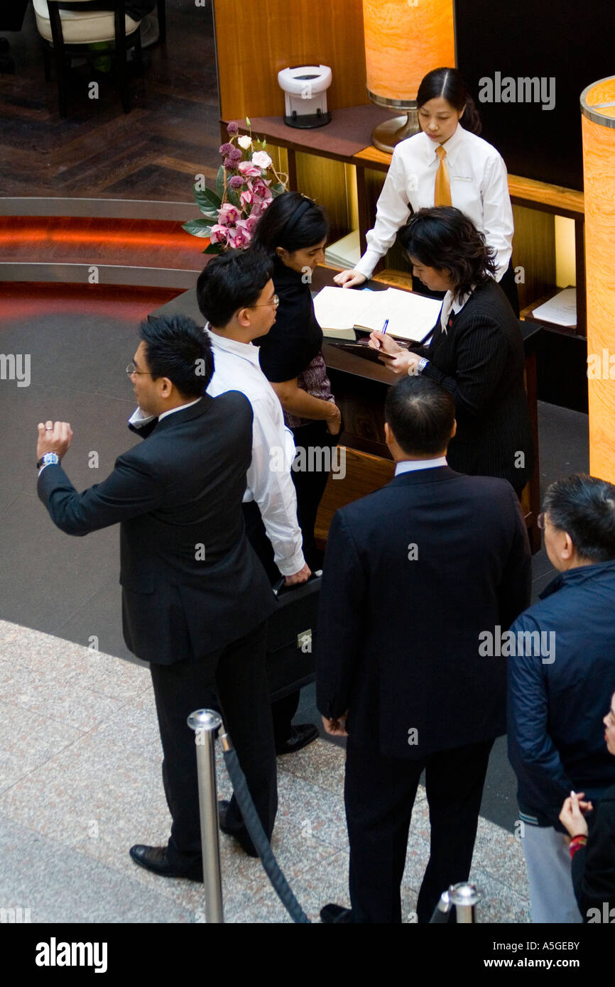 Hostess and a Line of Businessman Waiting during Lunch at an Upscale ...