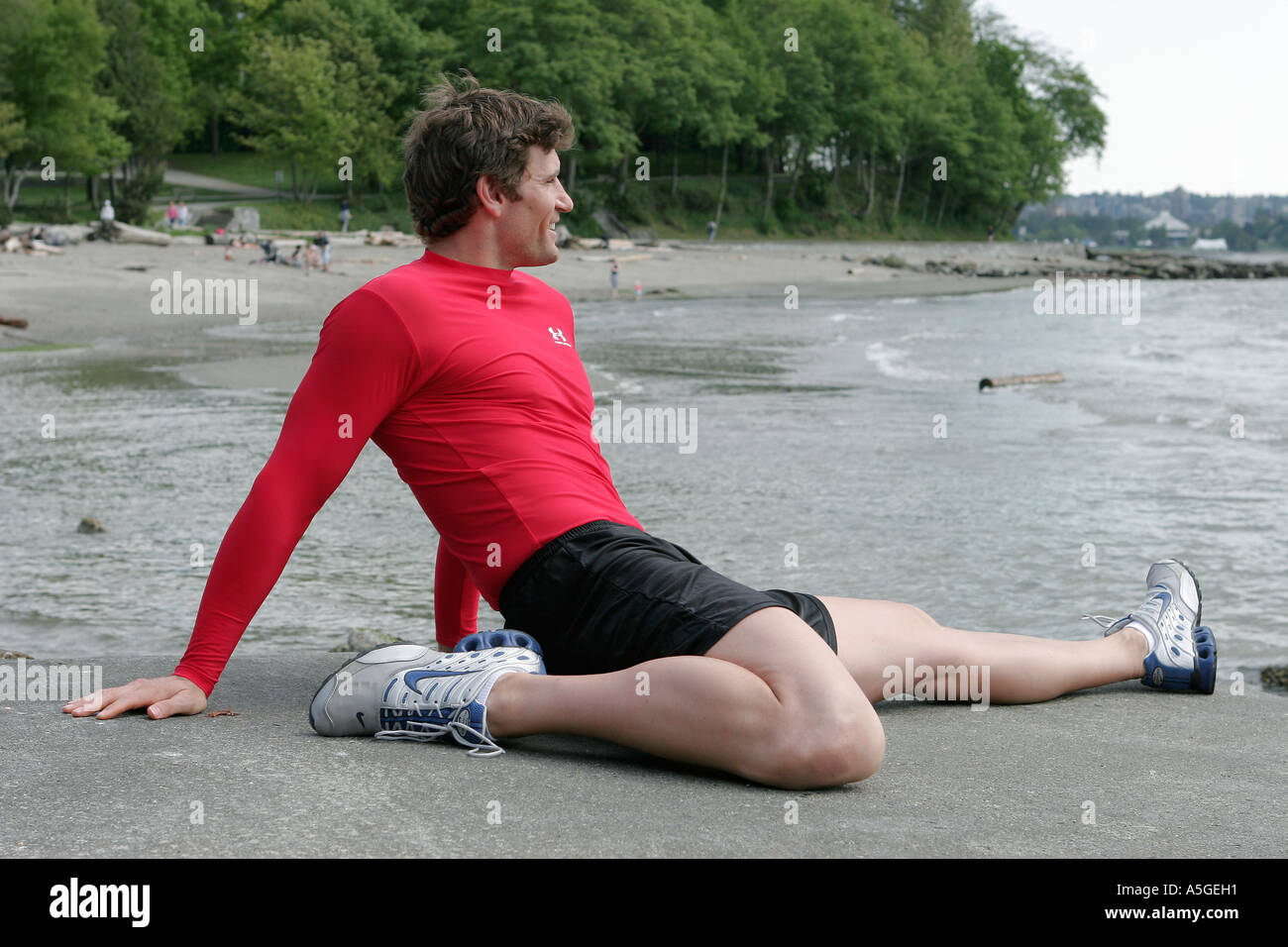 fit male model stretching outside Stock Photo - Alamy