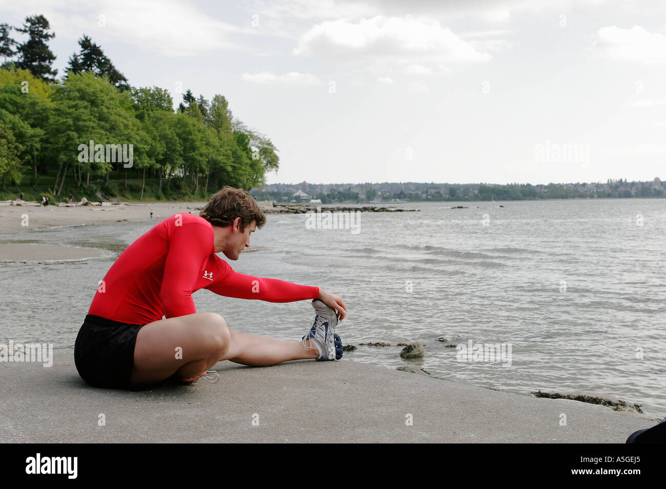 fit male model stretching outside Stock Photo - Alamy