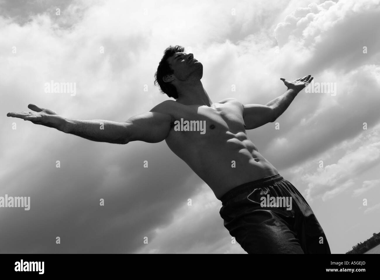 fit male model stretching outside Stock Photo - Alamy